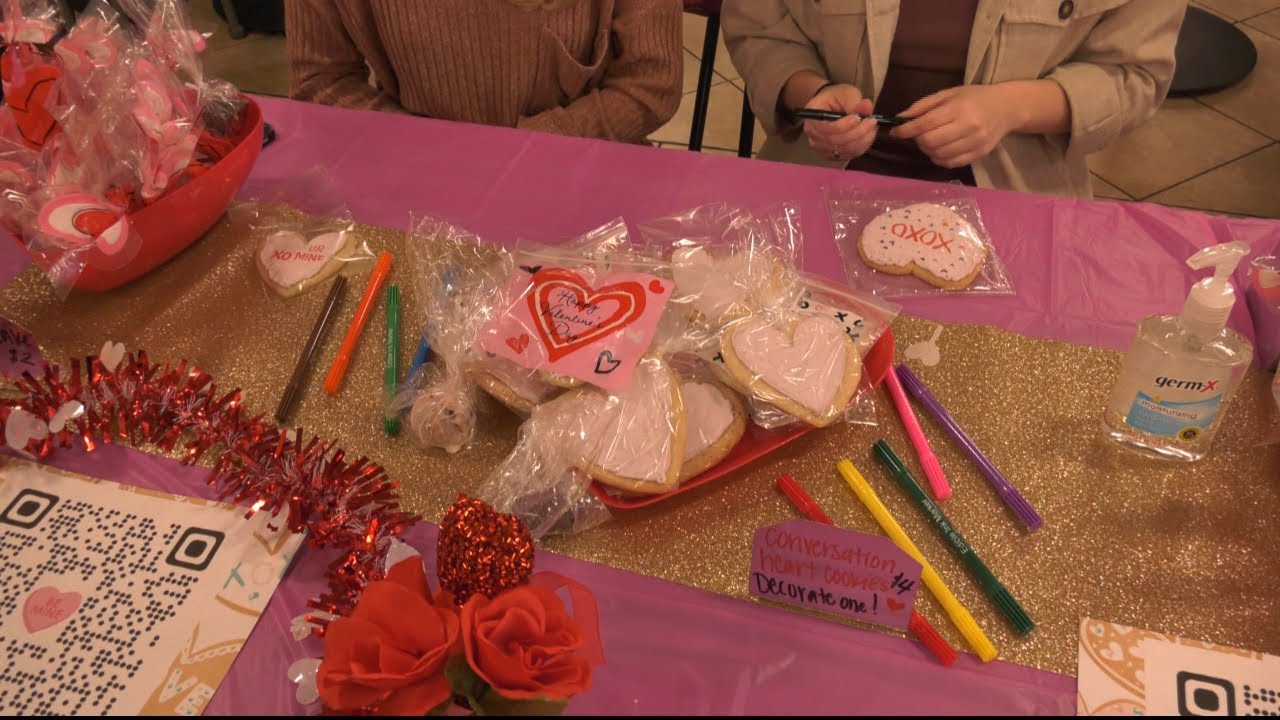 Students decorate personalized Valentine's Day cookies - TrojanVision