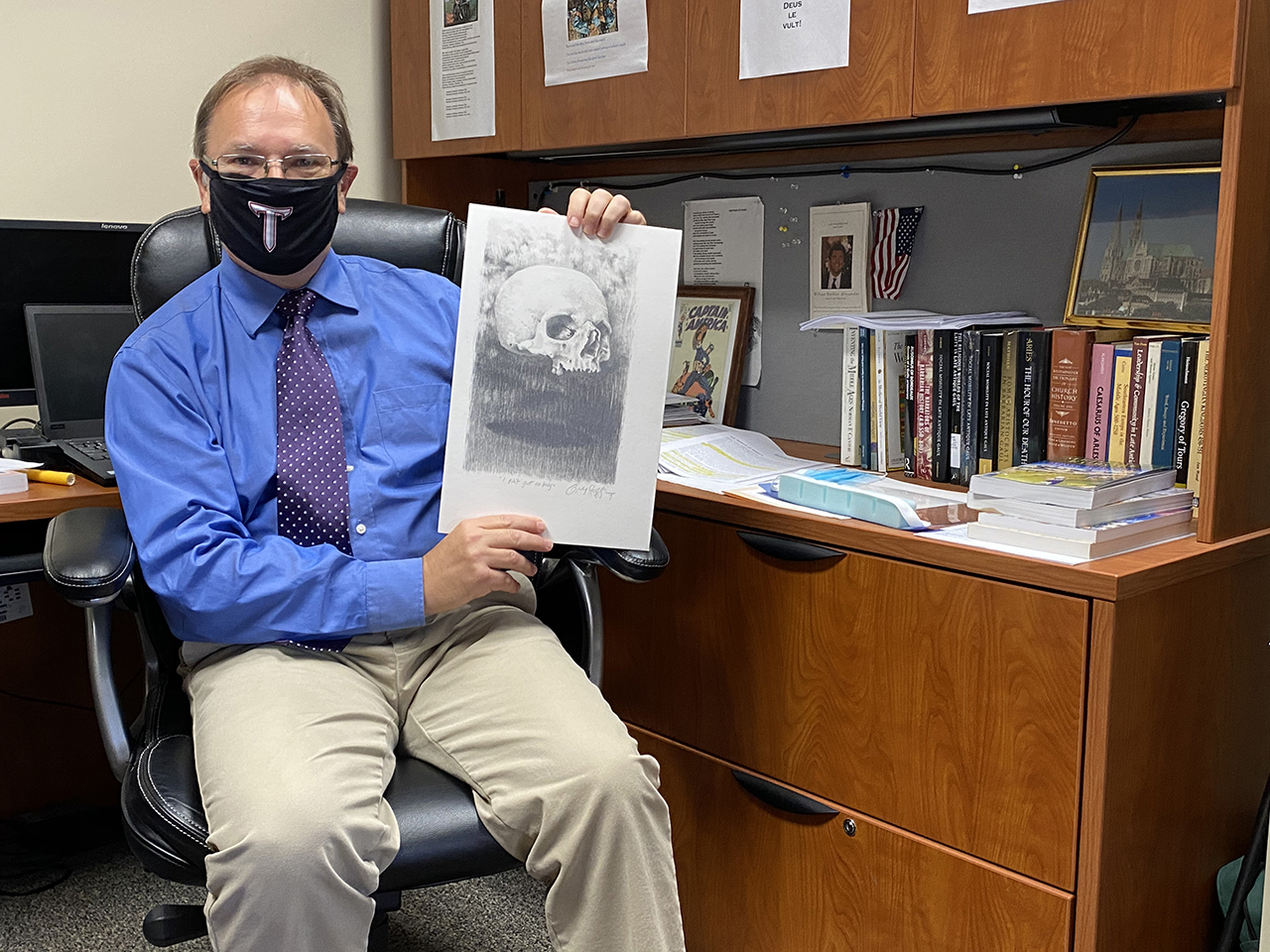 Professor’s new book features art from TROY colleague - Troy Today