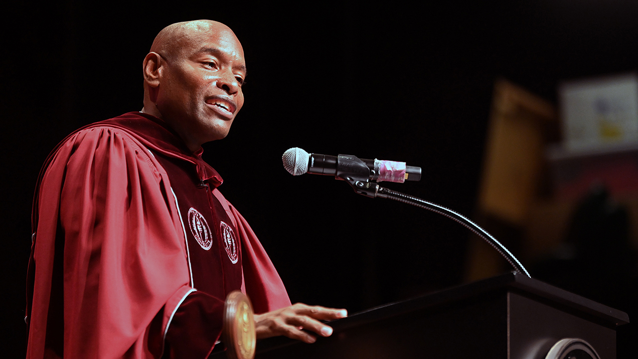 Sloan encourages graduates to move ahead with determination to make a ...